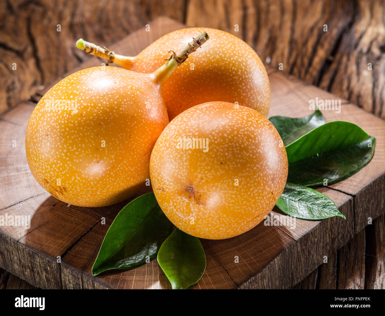 Granadilla fruits on the wooden table Stock Photo - Alamy