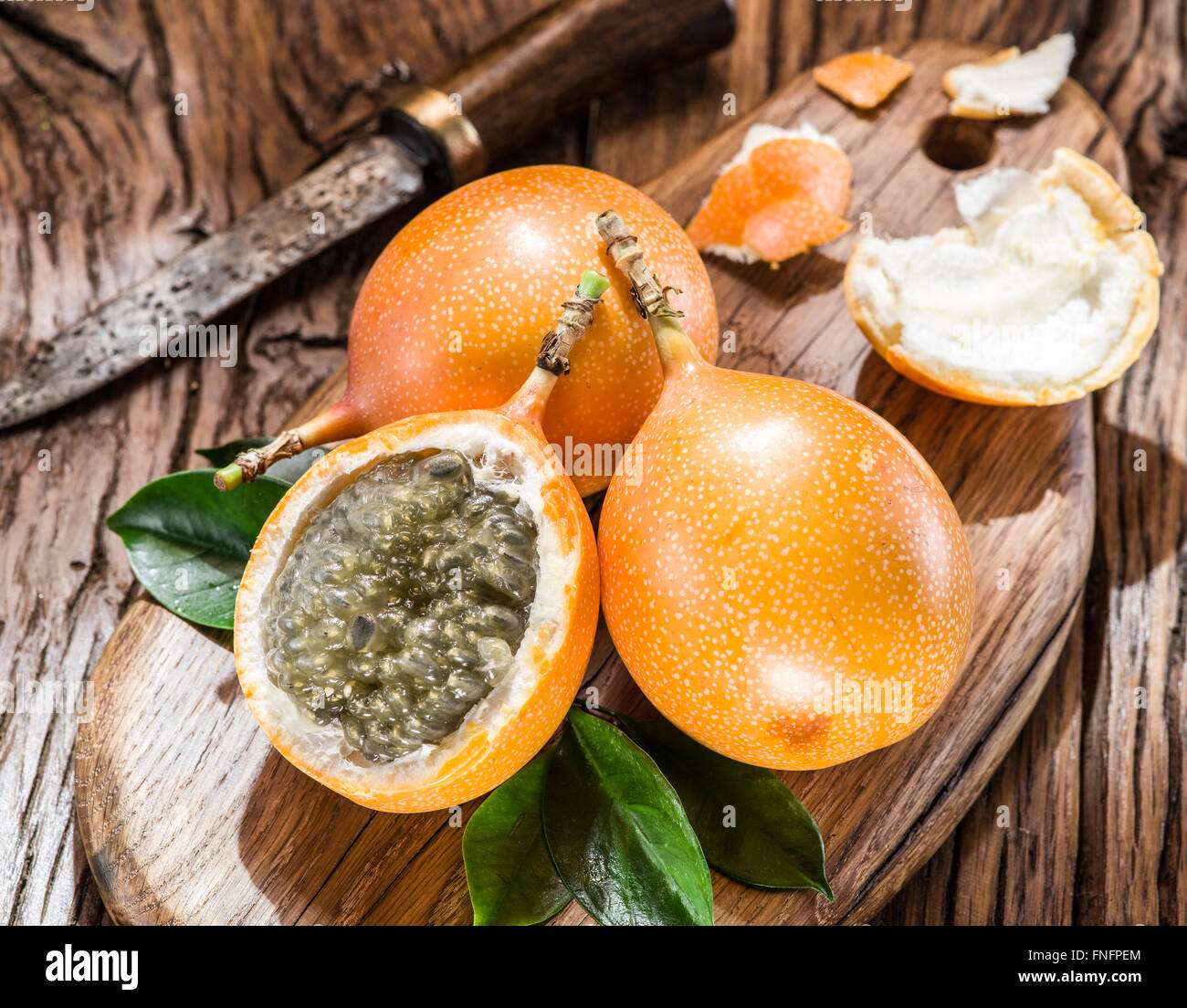 Granadilla fruits on the wooden table Stock Photo - Alamy