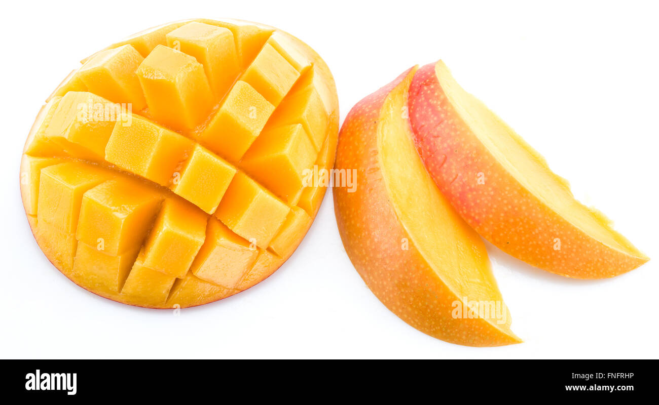 Mango cubes. Isolated on a white background Stock Photo - Alamy