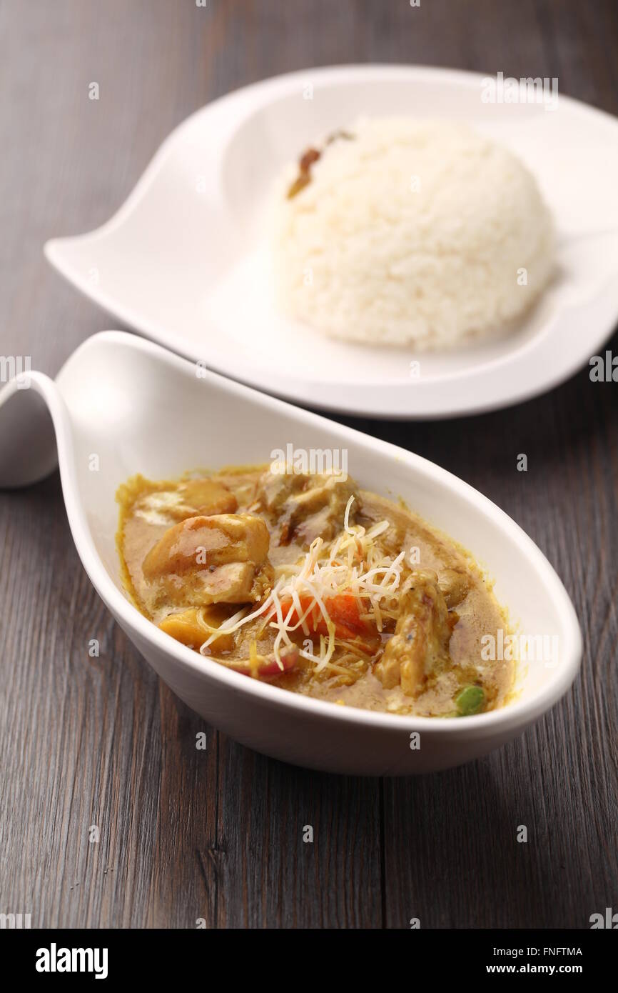 Chinese cuisine served in a bowl with plate of rice Stock Photo - Alamy