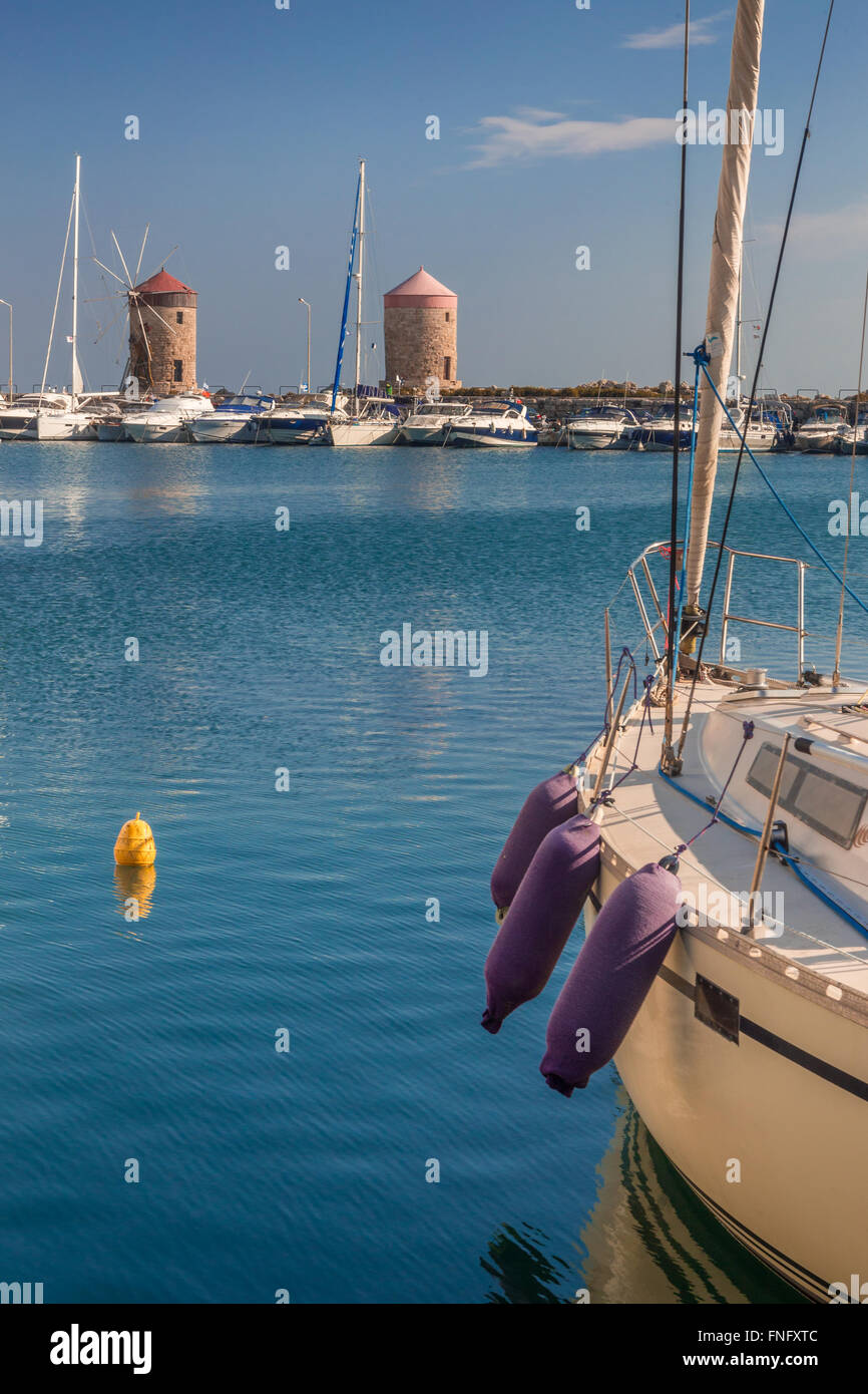 View of Mandraki harbour and the famous windmills in Rhodes island of ...