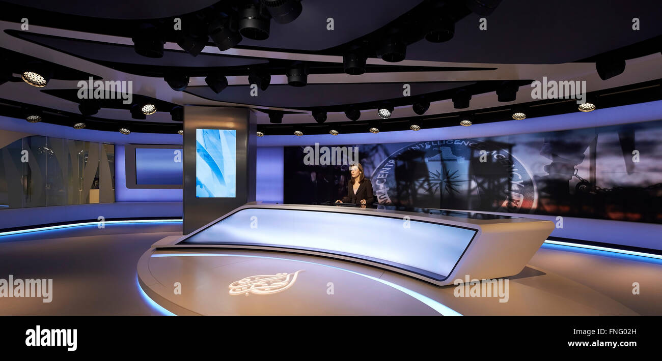 View of news studio with female news presenter. Al Jazeera Studio at ...