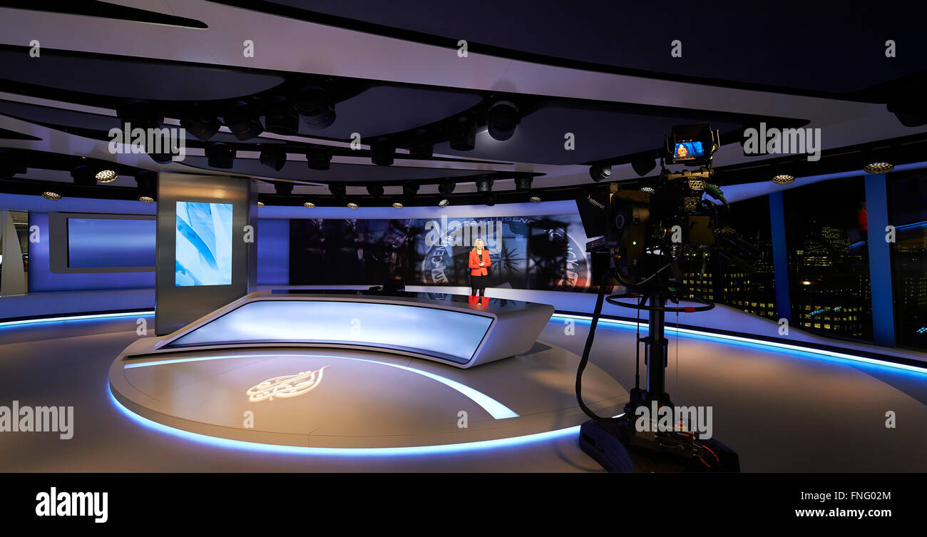 News studio with presenter and silhouetted camera. Al Jazeera Studio at ...
