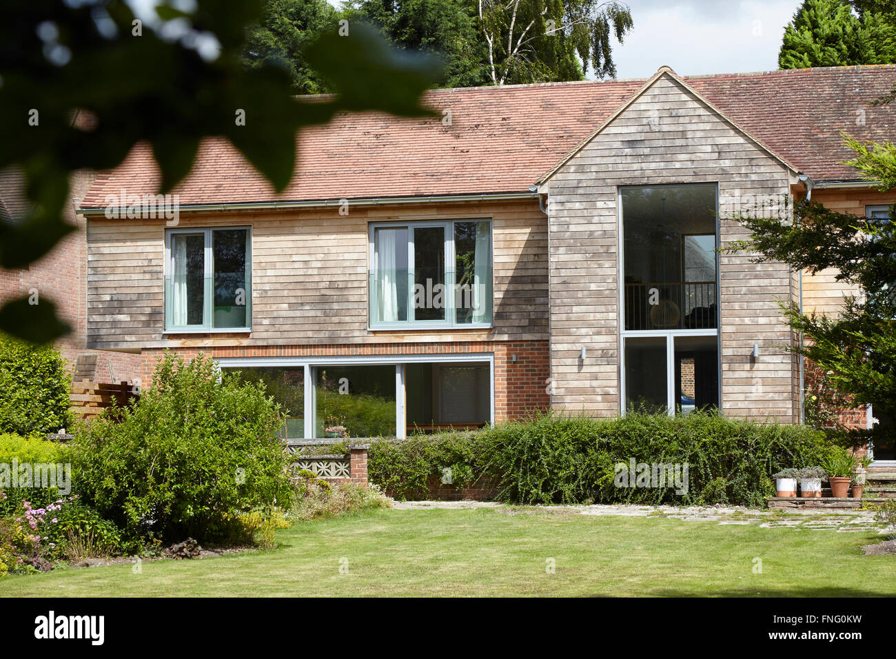 Oak cladding exterior facade window garden double height hi-res stock ...