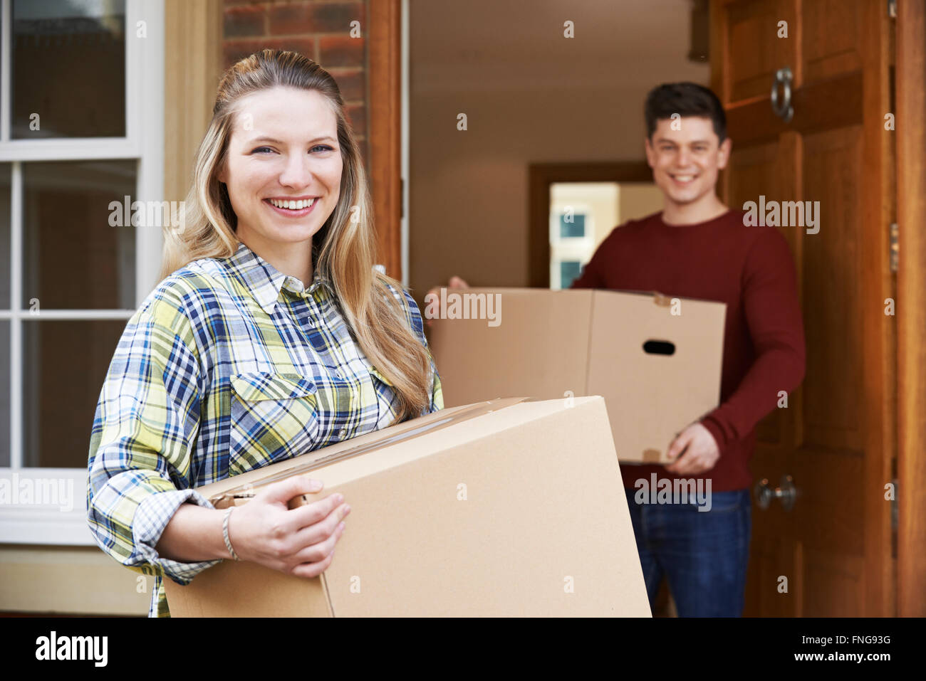 Young Couple Moving In To New Home Together Stock Photo - Alamy
