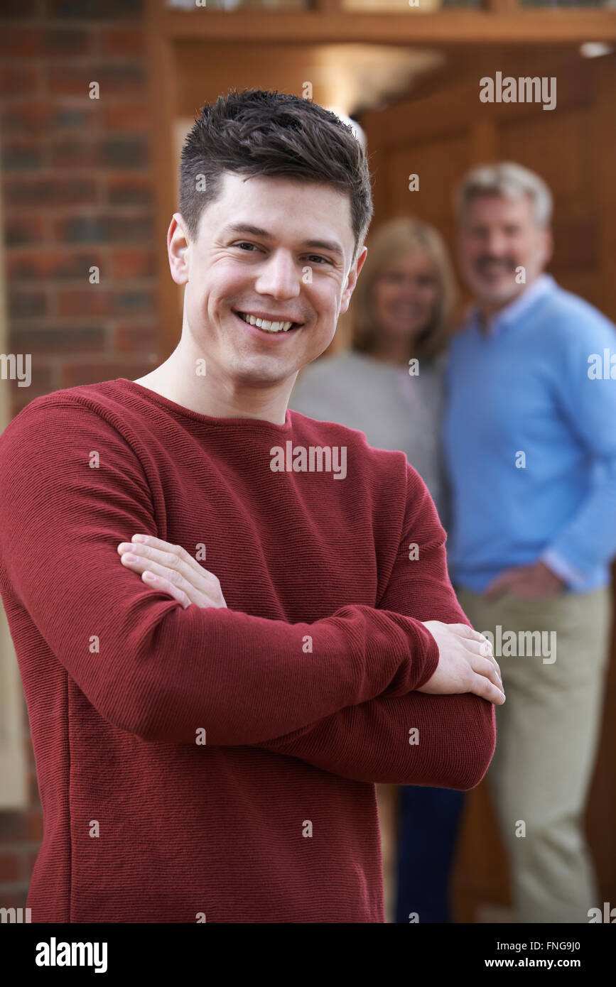 Portrait Of Young Man With Parents At Home Stock Photo - Alamy