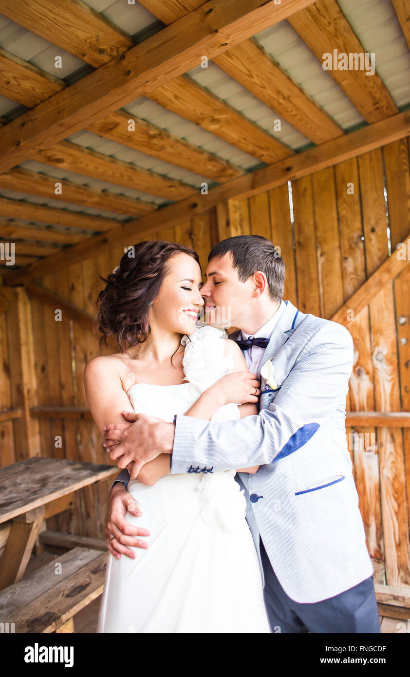 wedding pair hugging and kissing Stock Photo - Alamy