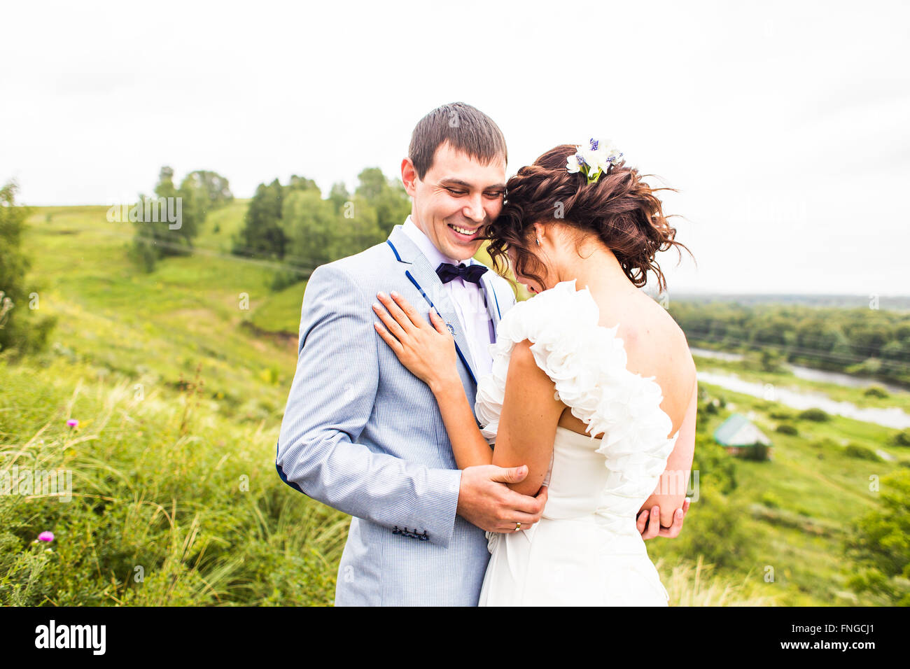 wedding pair hugging and kissing Stock Photo - Alamy