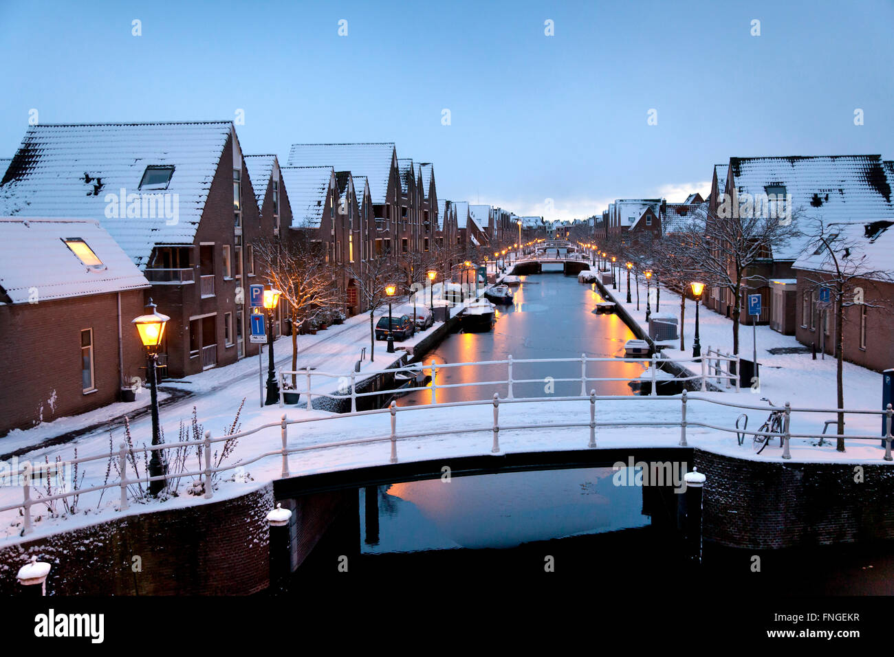 Canal and bridge in winter in Leiden, Holland Stock Photo - Alamy