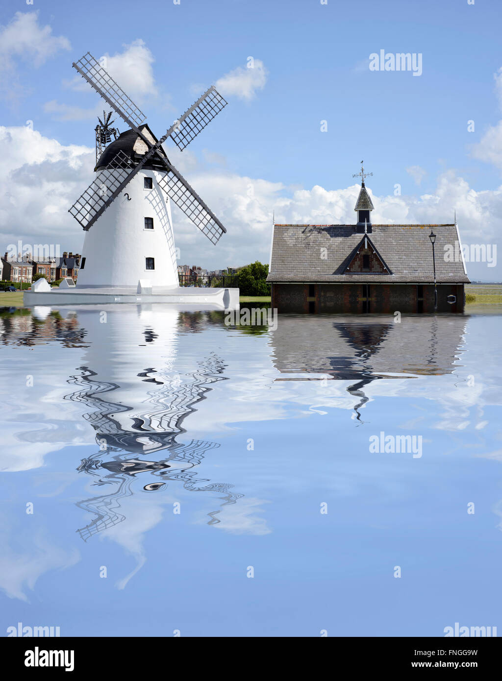 Digitally manipulated image of a white windmill reflecting in a pool of ...