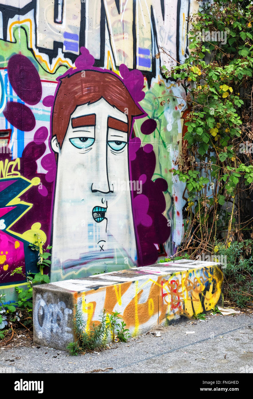 Street art and graffiti and painted bench on Riverside walk along Pank ...