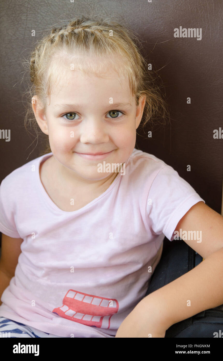 Happy girl sitting on a chair in an electric train Stock Photo - Alamy