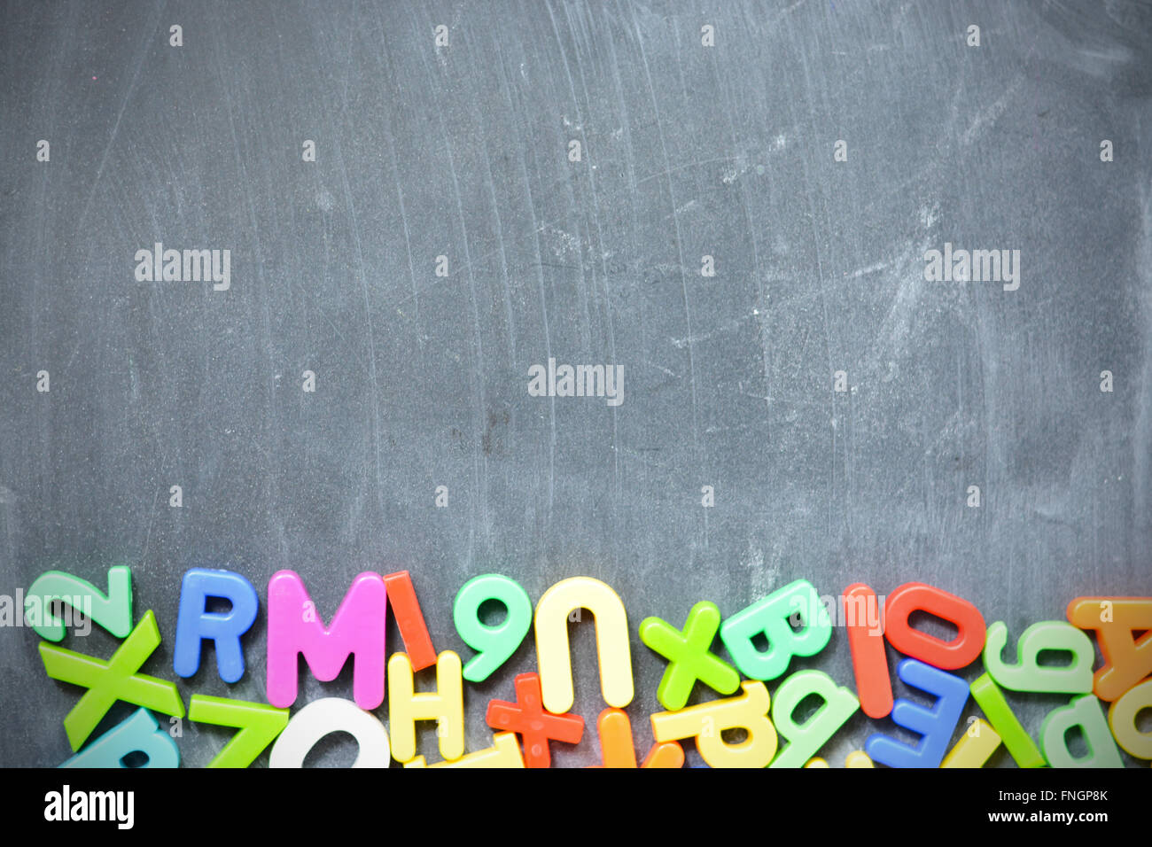 Blackboard background with colored letter blocks Stock Photo - Alamy