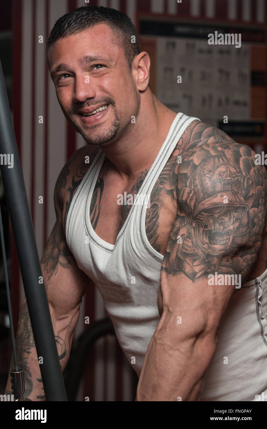 Adult Bodybuilder Doing Heavy Weight Exercise For Triceps Stock Photo ...