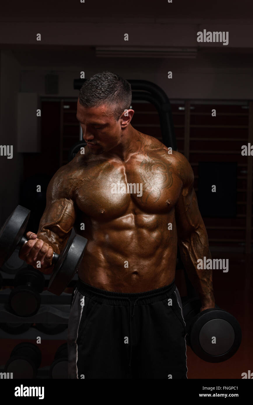 Bodybuilder Working Out Biceps - Dumbbell Concentration Curls - Best ...