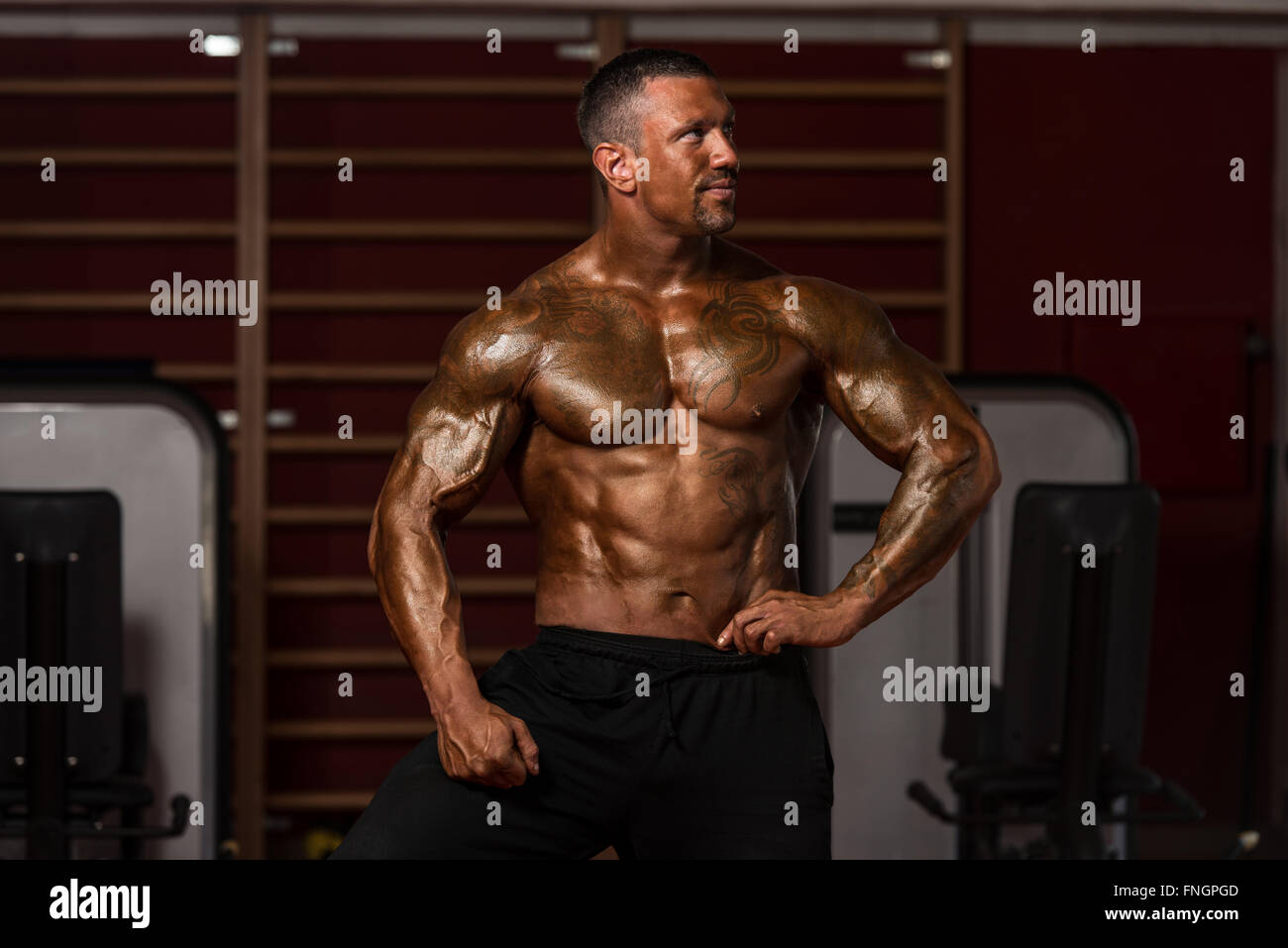 Serious man standing flexing hi-res stock photography and images - Alamy