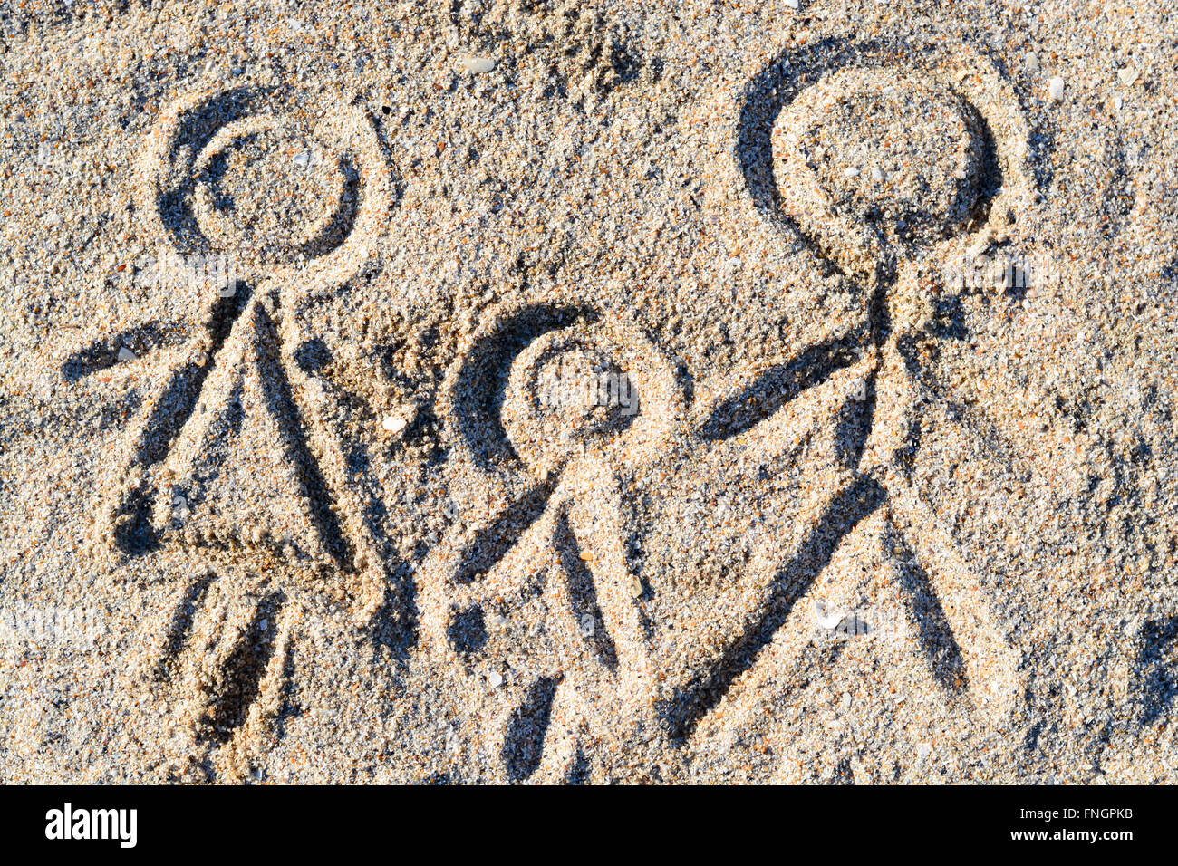 Happy family drawing on beach hi-res stock photography and images - Alamy