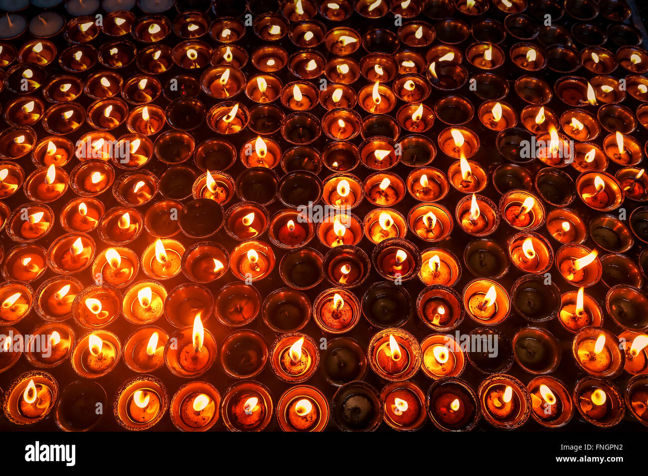 Hindu prayer candles in shrine hi-res stock photography and images - Alamy