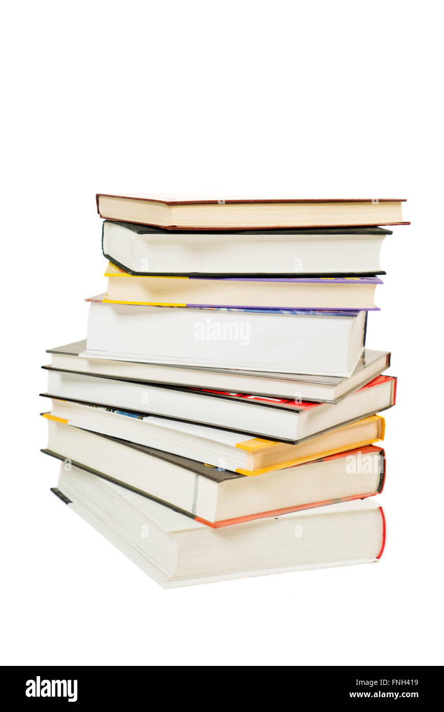 Pile of books with different colors of covers and white background ...