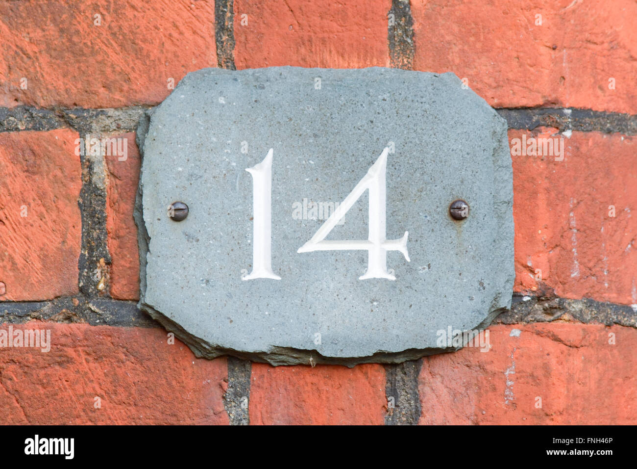 House number 14 sign slate on red brick wall Stock Photo - Alamy