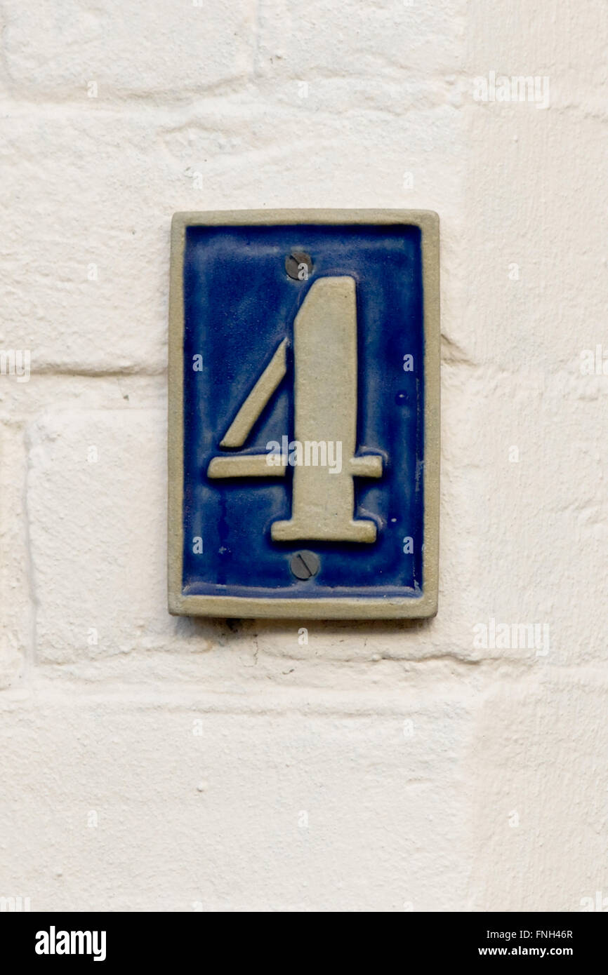 House number 4 sign in blue and gold Stock Photo - Alamy