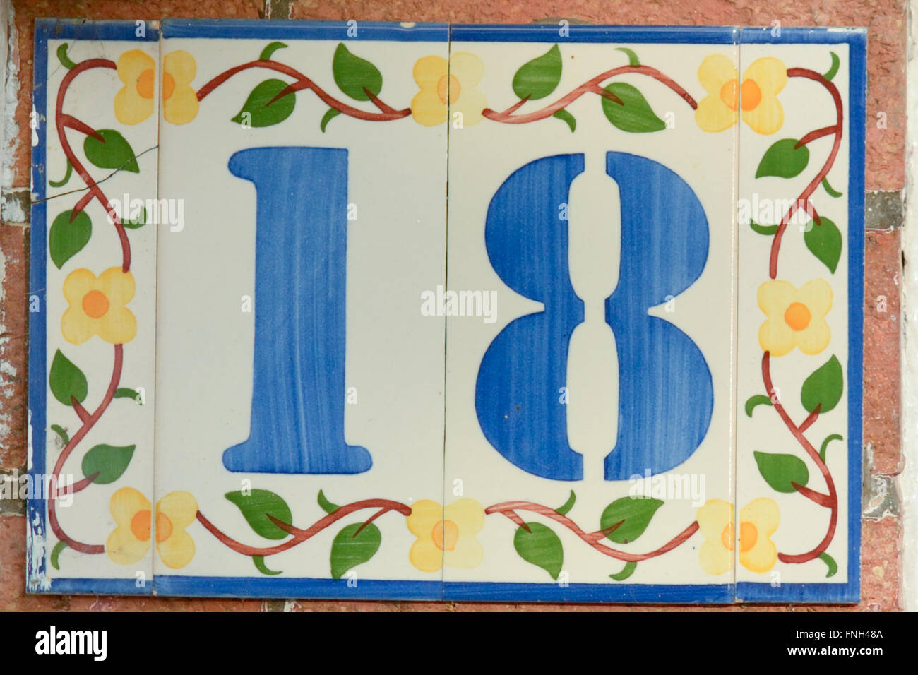 House number 18 sign painted tiles Stock Photo - Alamy