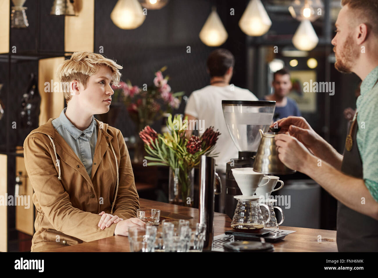 Woman having coffee tasting session at a modern cafe Stock Photo - Alamy