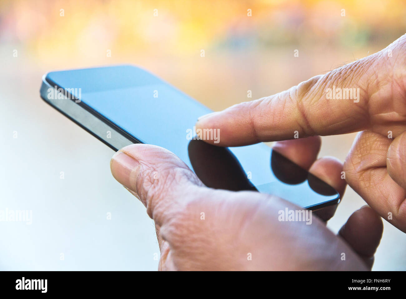 man texting on his smartphone Stock Photo - Alamy