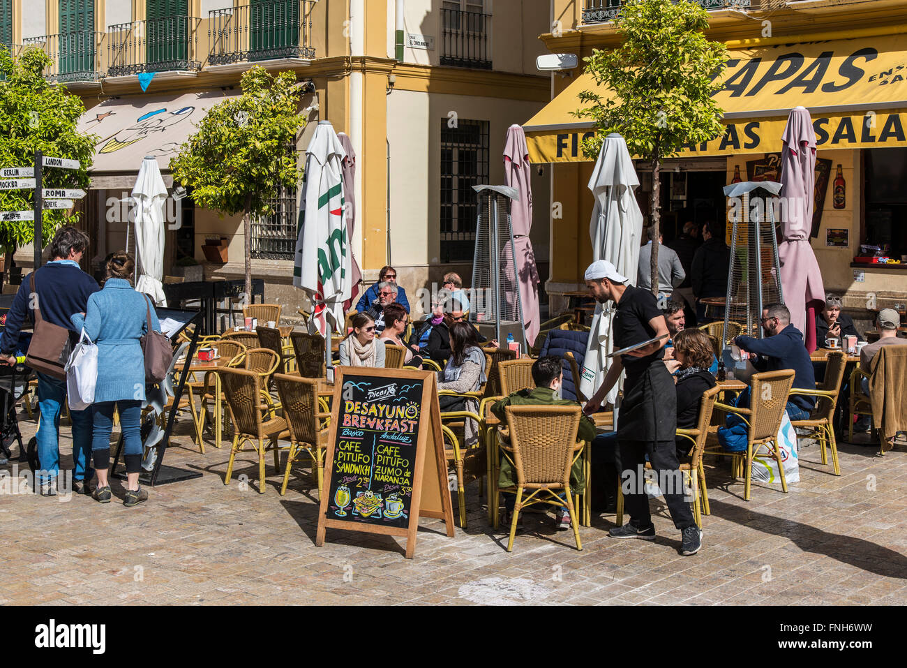 Tourists seated at tables outside a tapas bar restaurant, Plaza de la ...