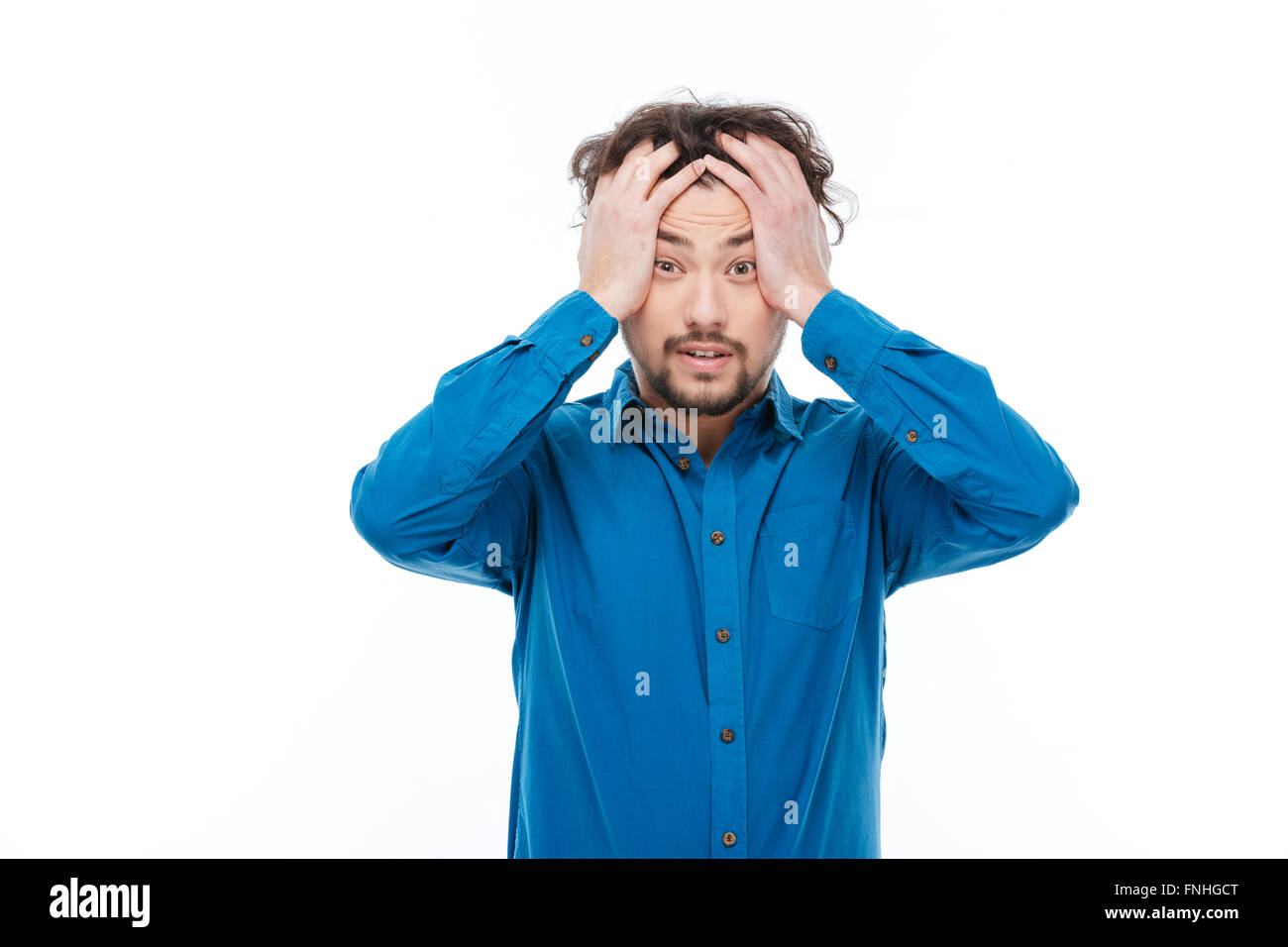 Stressed casual man standing isolated on a white background Stock Photo ...
