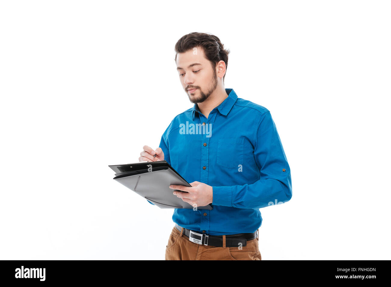 Casual man writing something in clipboard isolated on a white ...