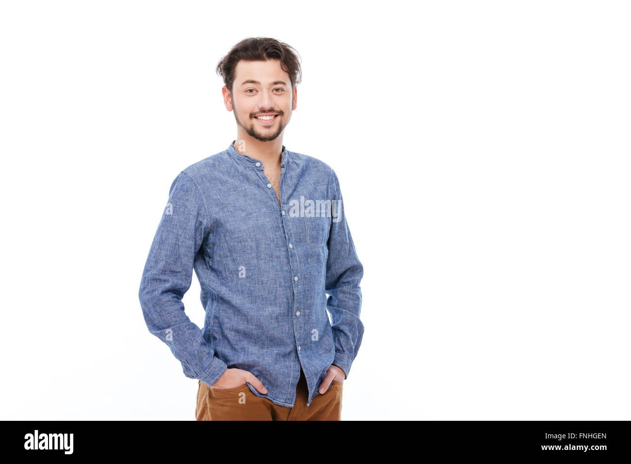 Happy casual man standing isolated on a white background Stock Photo ...