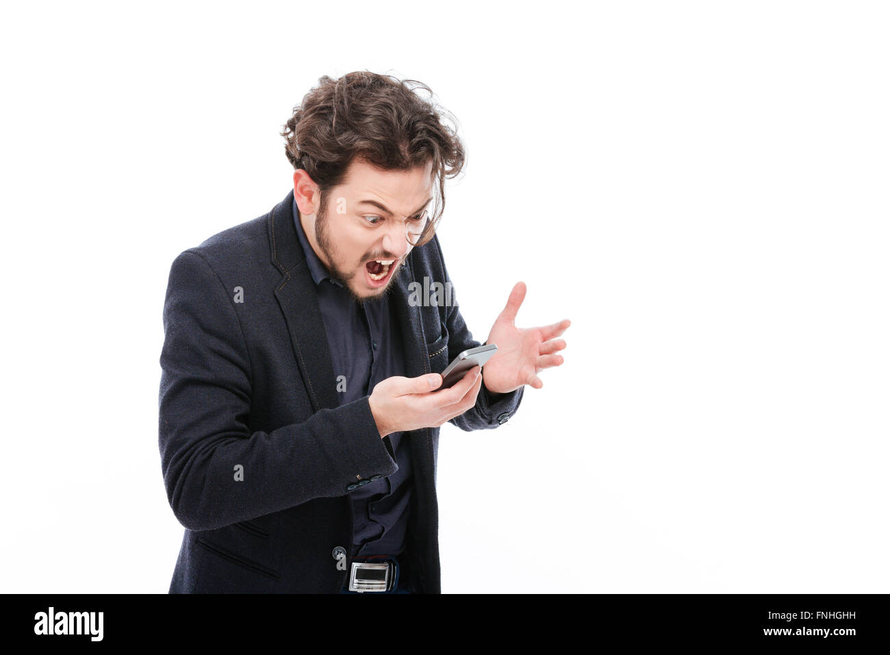Businessman screaming on the phone isolated on a white background Stock ...