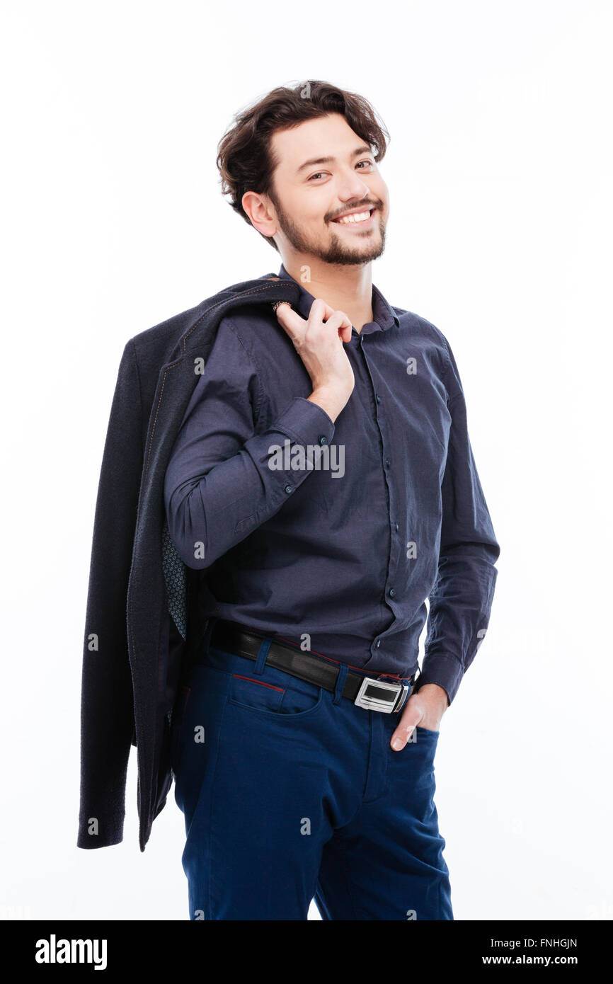 Smiling businessman holding jacket on the shoulder isolated on a white ...