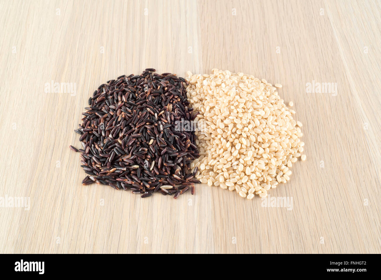 Rice thai black, brown rice, carnaroli rice on wooden table Stock Photo ...