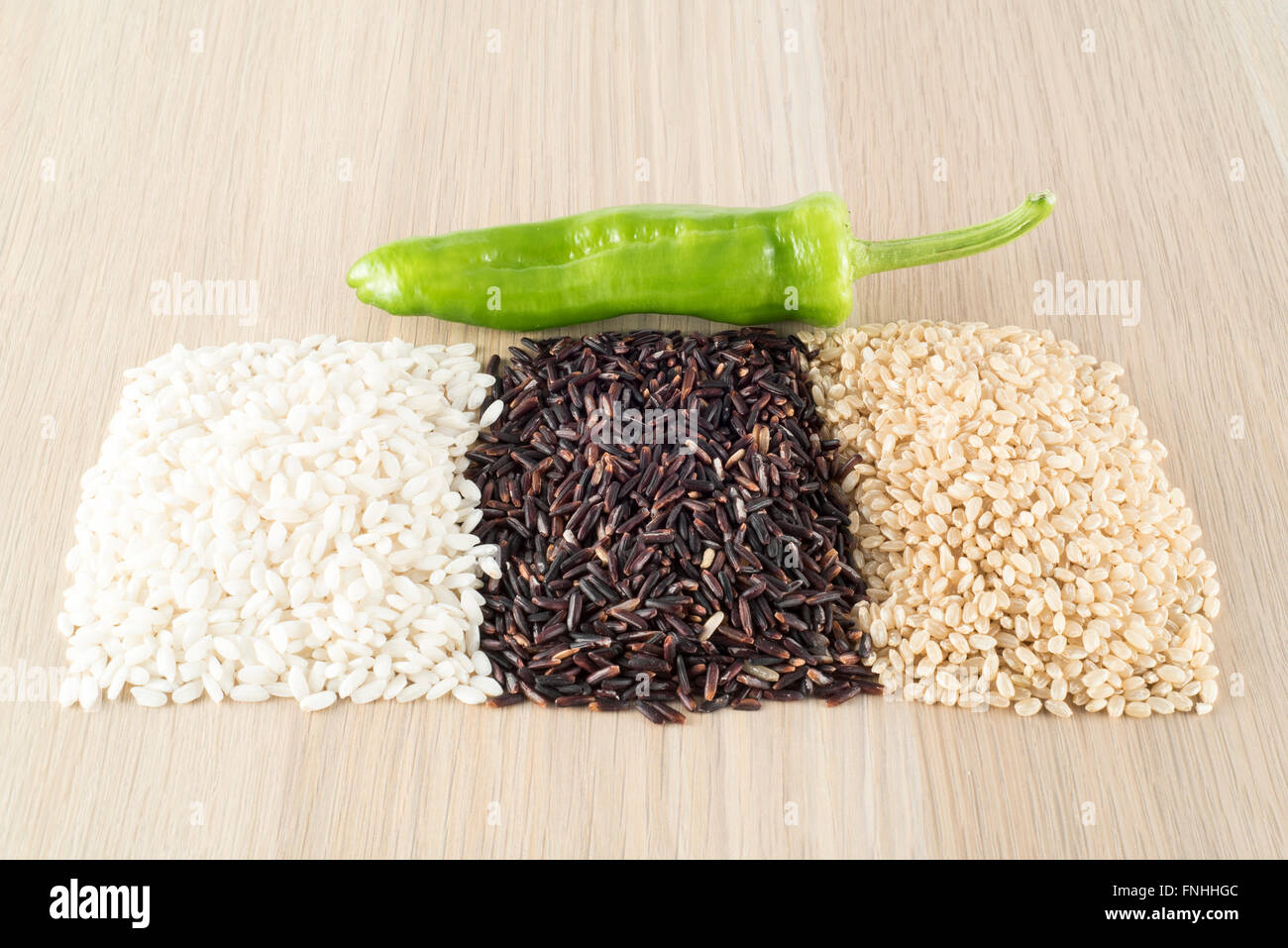 Rice thai black, brown rice, carnaroli rice on wooden table Stock Photo ...