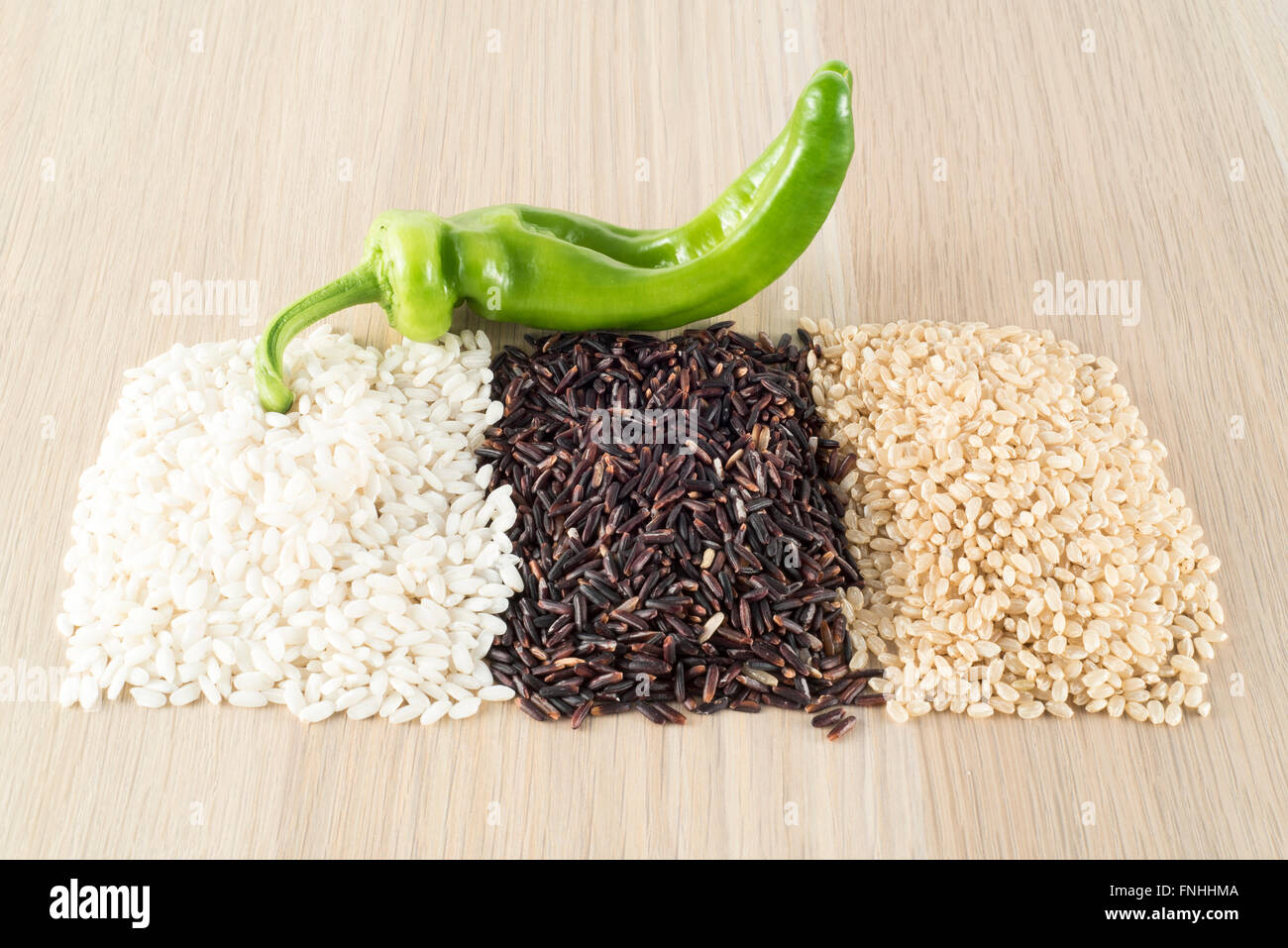 Rice thai black, brown rice, carnaroli rice on wooden table Stock Photo ...