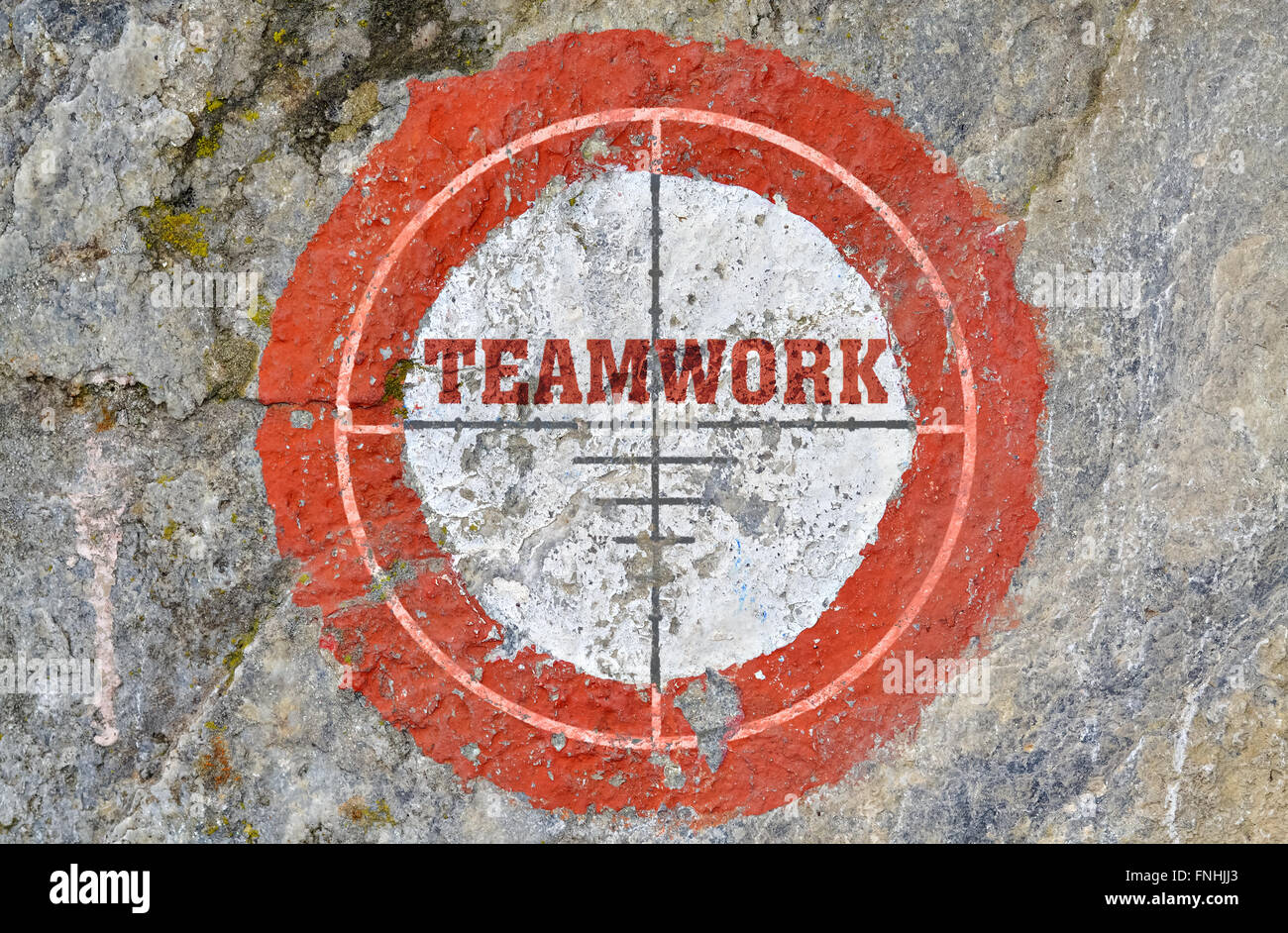 Single word Teamwork in the center of a red circle on textured ...