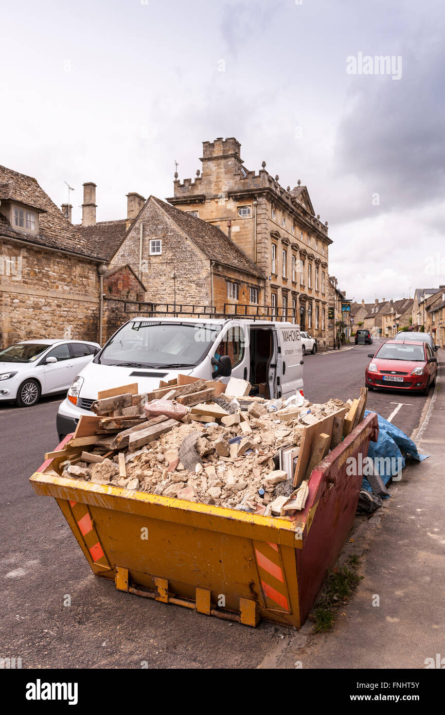 A builders skip spoils the view of the pretty Cotswold town of Burford ...