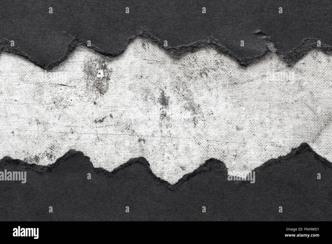 Torn black paper with a dirty canvas background Stock Photo - Alamy