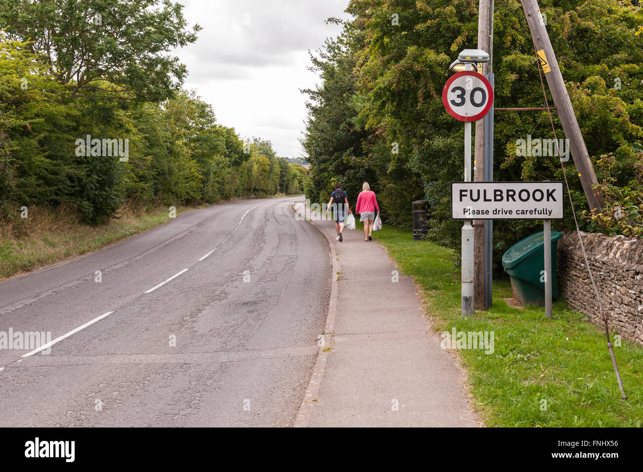 People walk into the village of Fulbrook near Burford , Oxfordshire ...