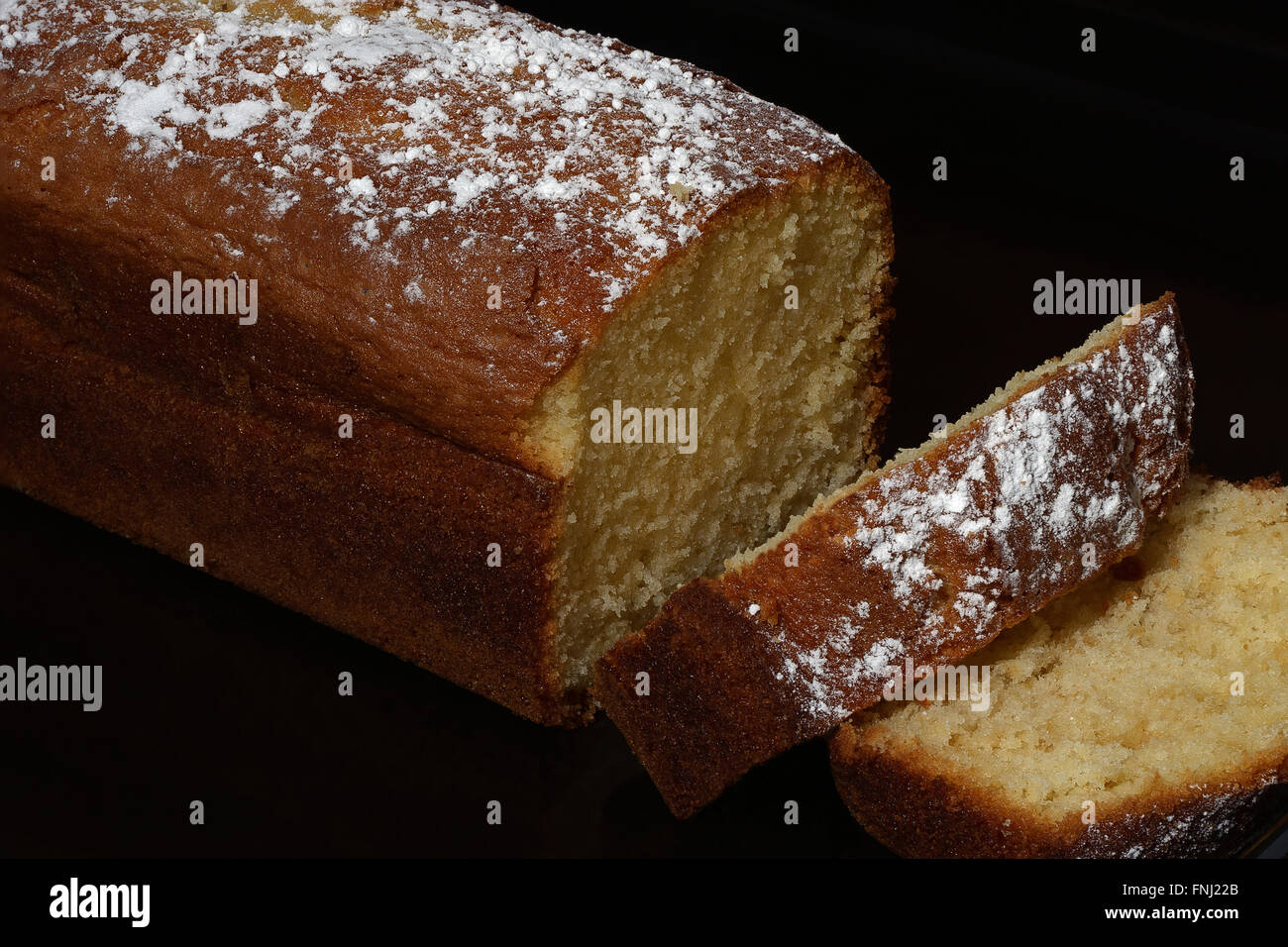 Cake sponge with icing sugar Stock Photo - Alamy