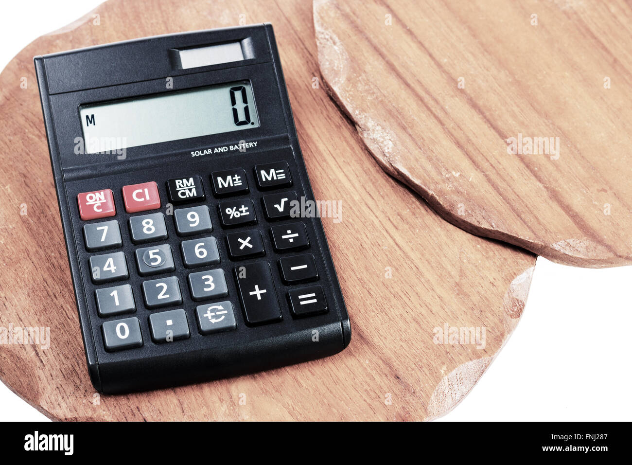 Calculator on background two wood texture Stock Photo - Alamy