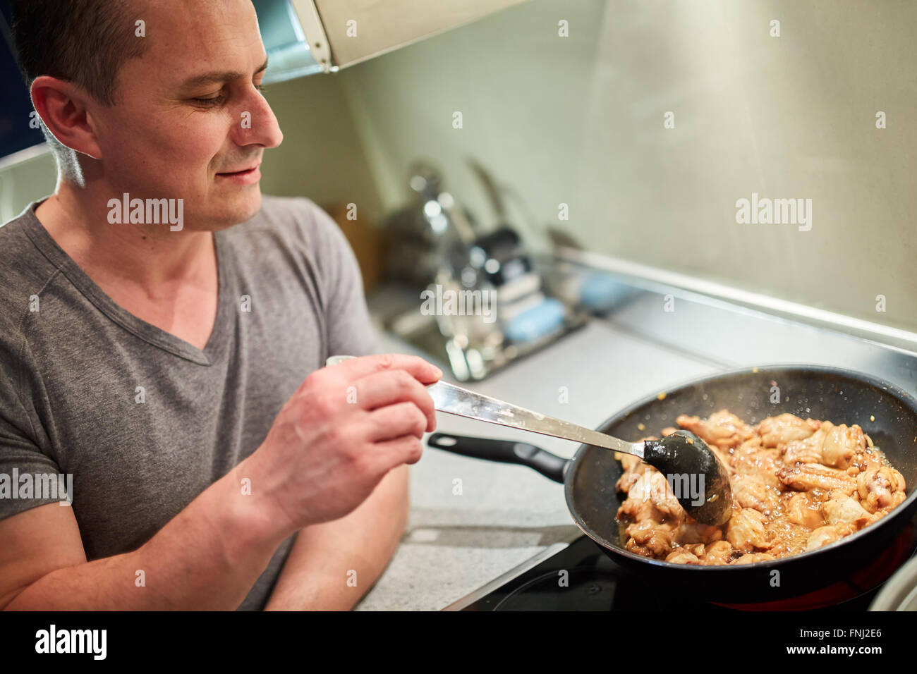 Man cooking in wok hi-res stock photography and images - Alamy