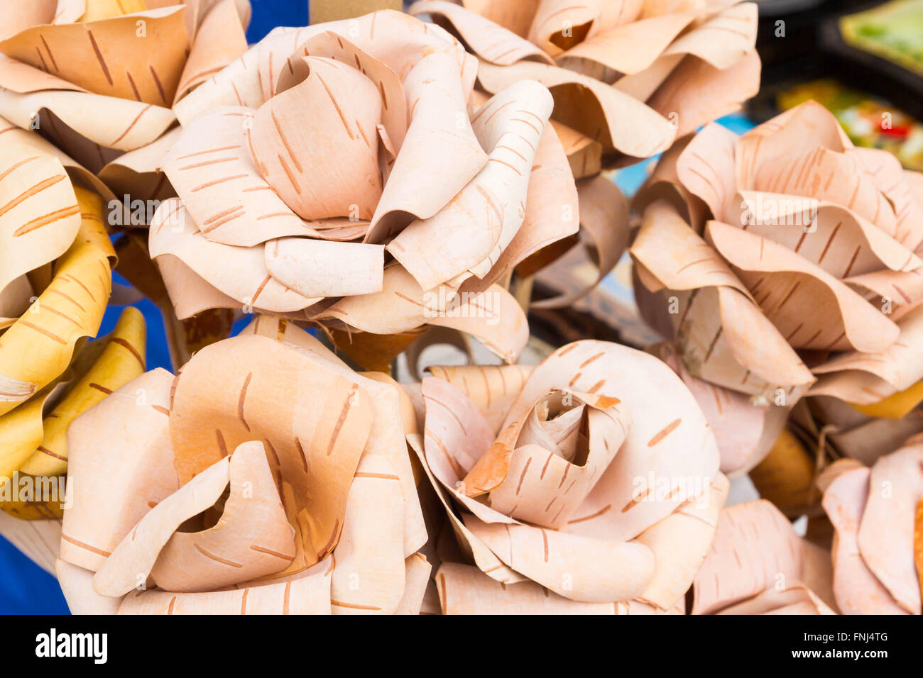 Flowers wooden roses made of birch bark Stock Photo - Alamy
