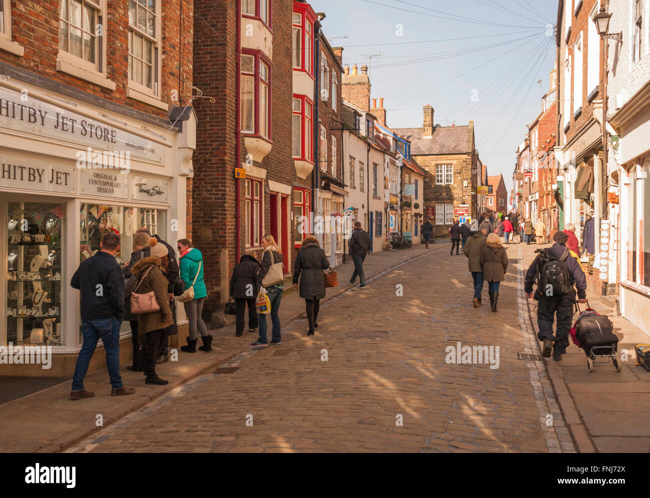 A view of Church Street,Whitby,North Yorkshire,England showing the ...