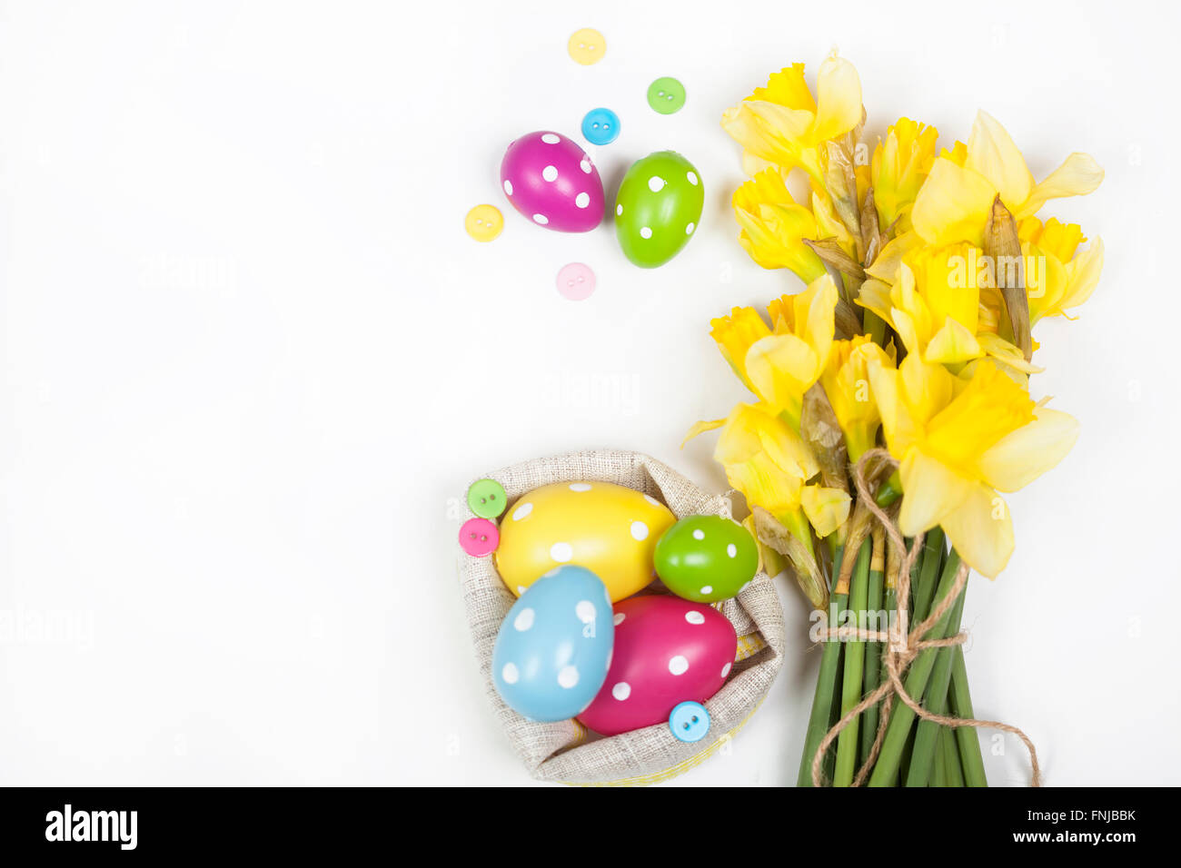 Easter background with colorful Easter eggs and a bouquet of yellow ...