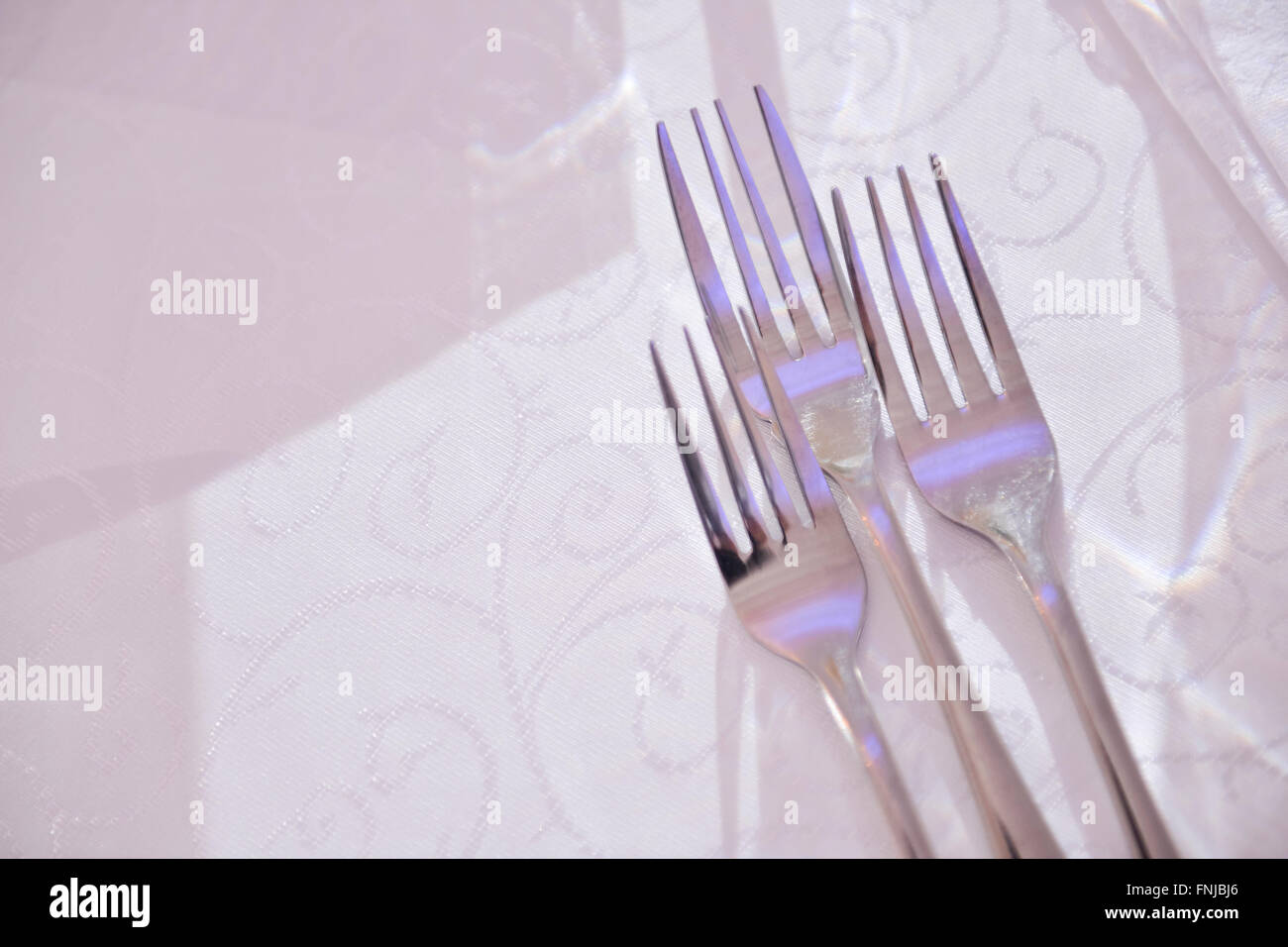 Forks placed on a table in restaurant Stock Photo - Alamy