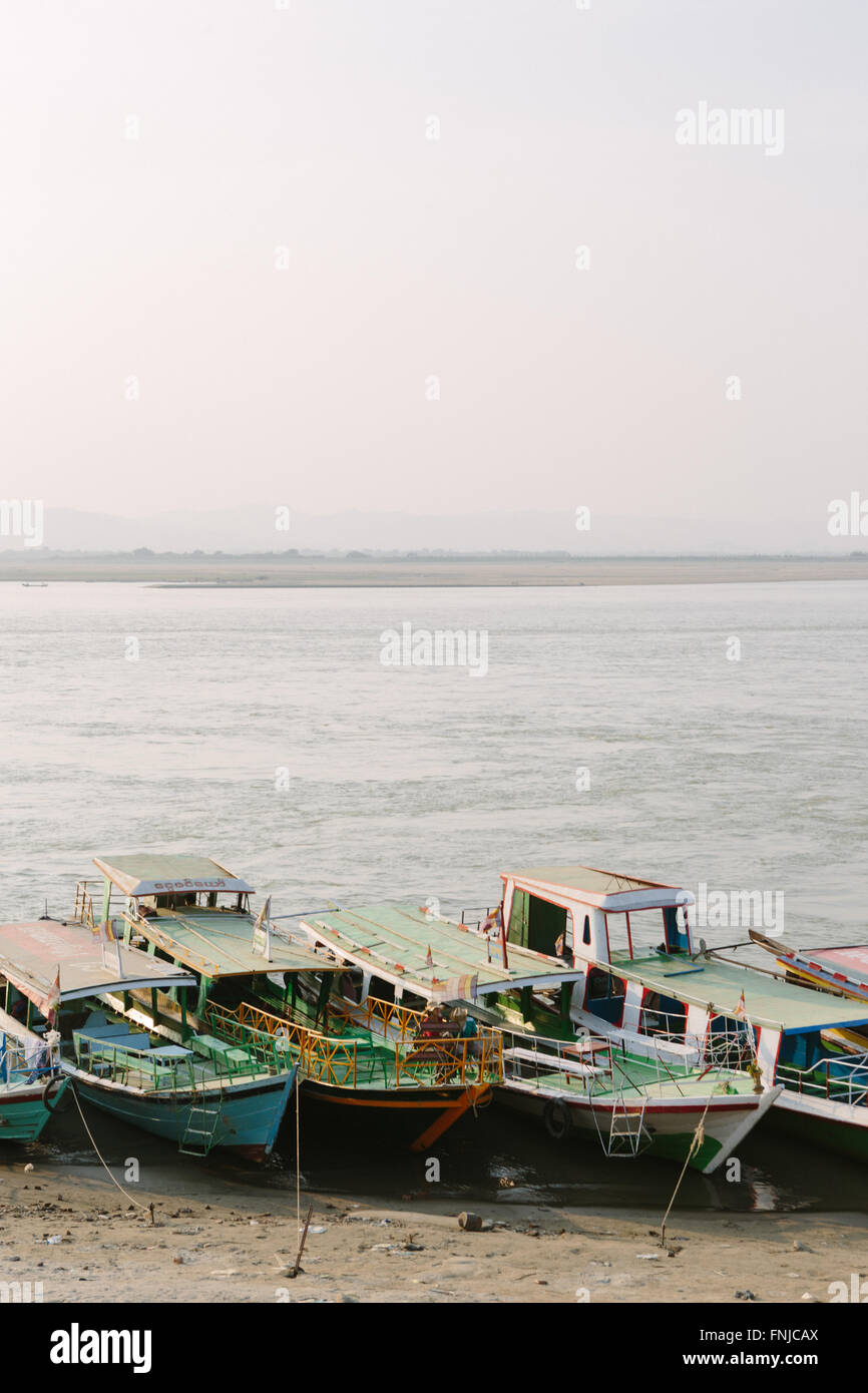 Boats parked at the banks of the Irrawaddy (Ayerwaddy) River in Myanmar ...