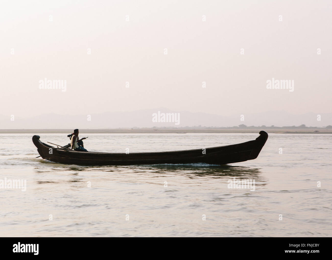 Long fishmerman boat on Ayerwaddy (Irrawaddy) River in Bagan, Myanmar ...
